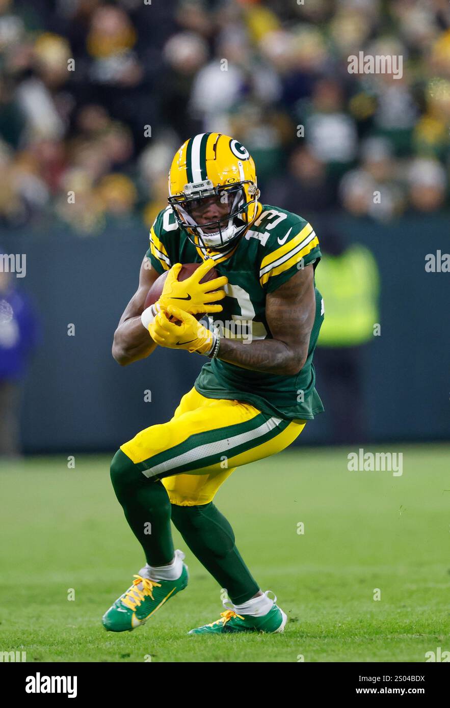 Green Bay Packers wide receiver Dontayvion Wicks (13) runs with the ...