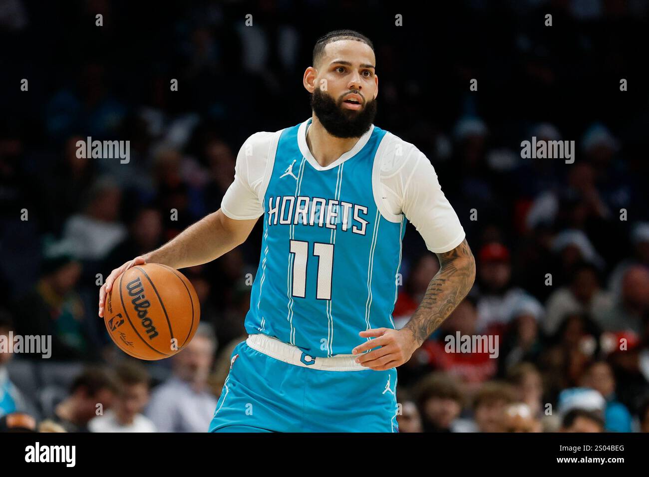 Charlotte Hornets forward Cody Martin moves the ball against the ...