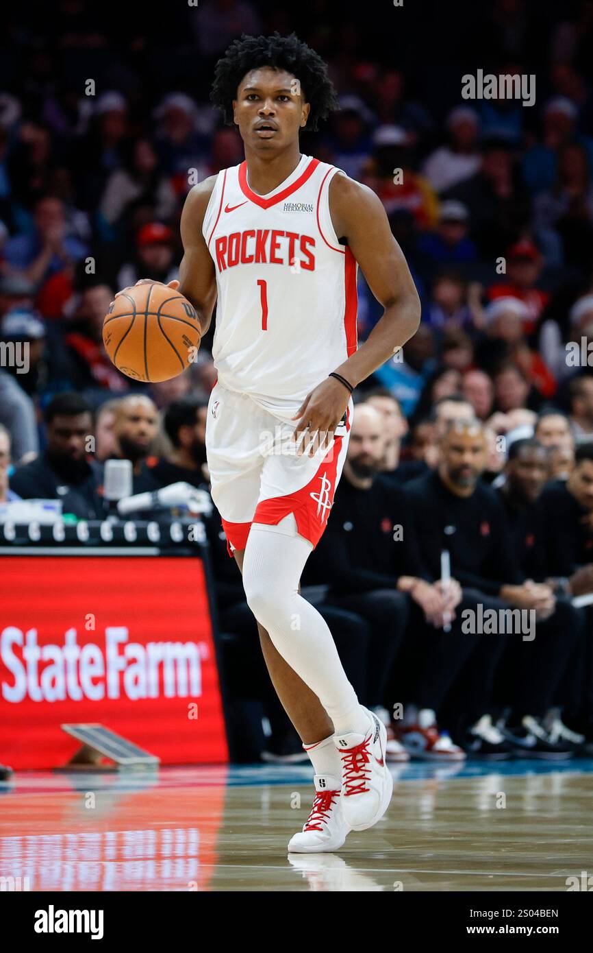 Houston Rockets forward Amen Thompson brings the ball upcourt during ...