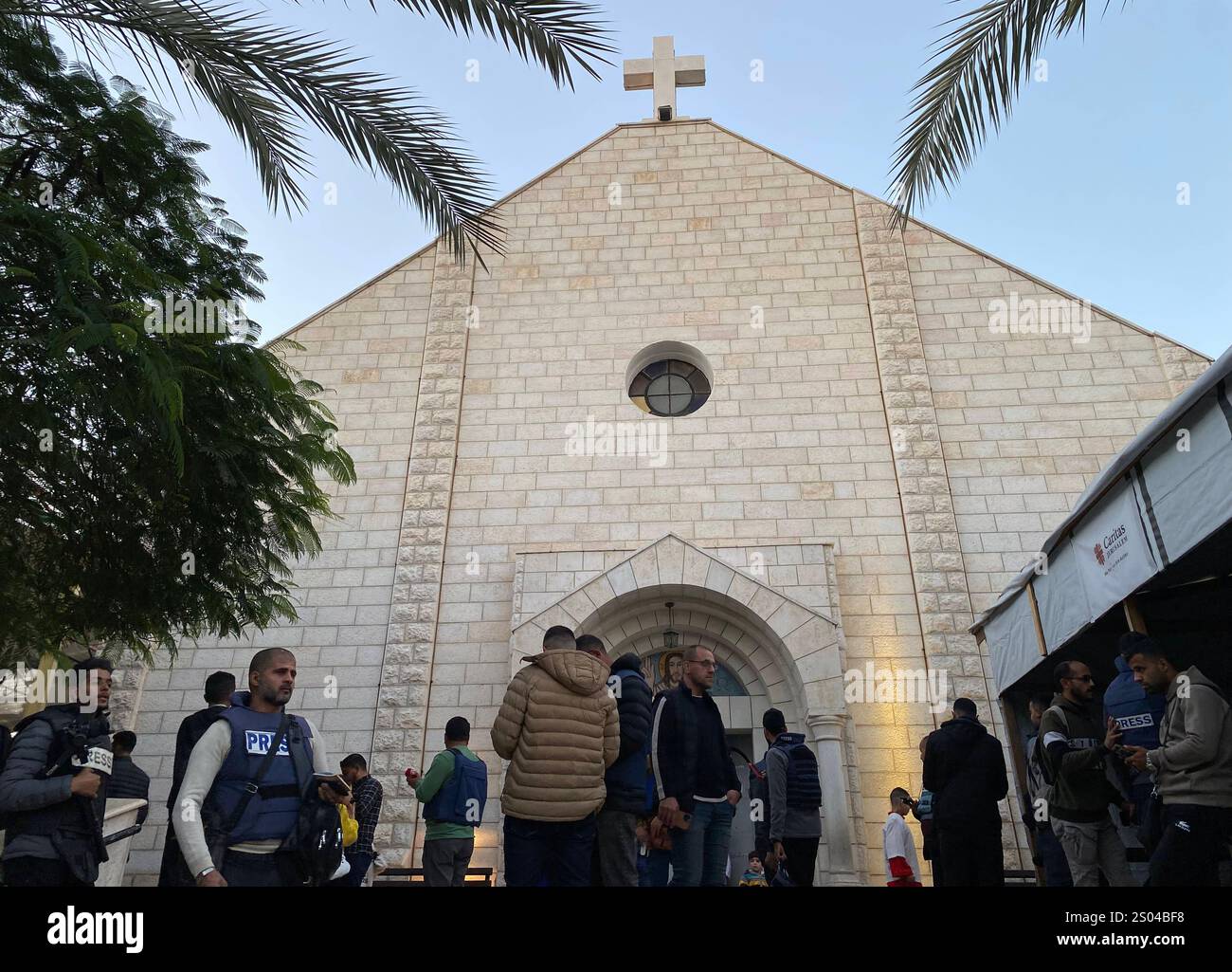 Palestinian Christians participate in the Christmas Mass at the Church ...