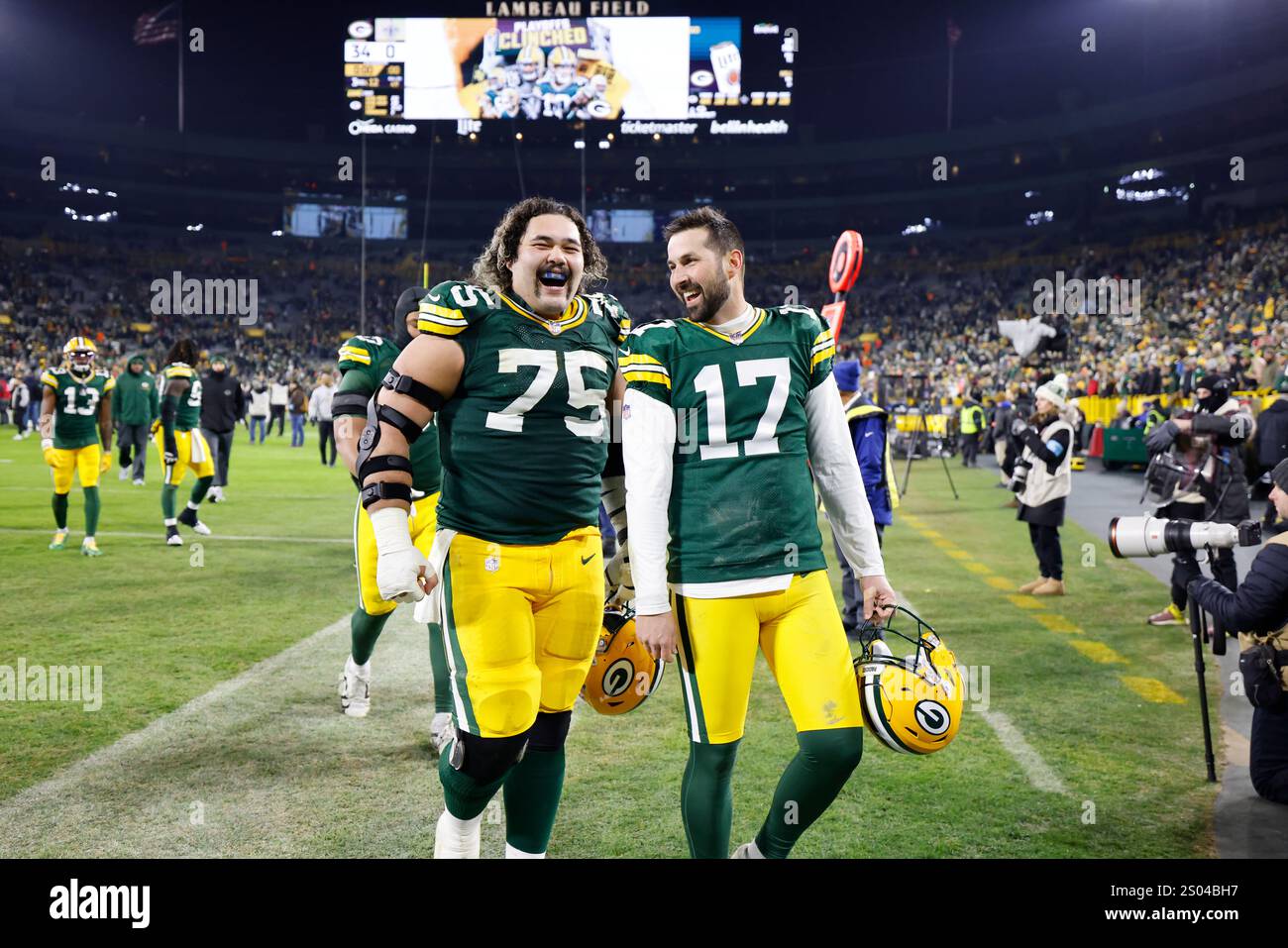 Green Bay Packers guard Sean Rhyan (75) and Green Bay Packers place ...