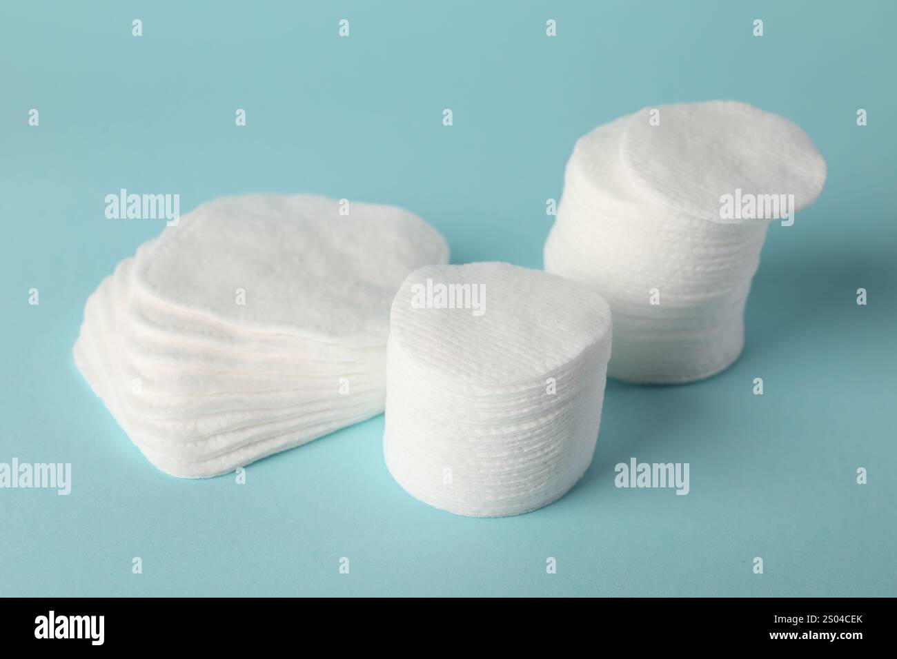 Clean cotton pads on light blue background, closeup Stock Photo - Alamy