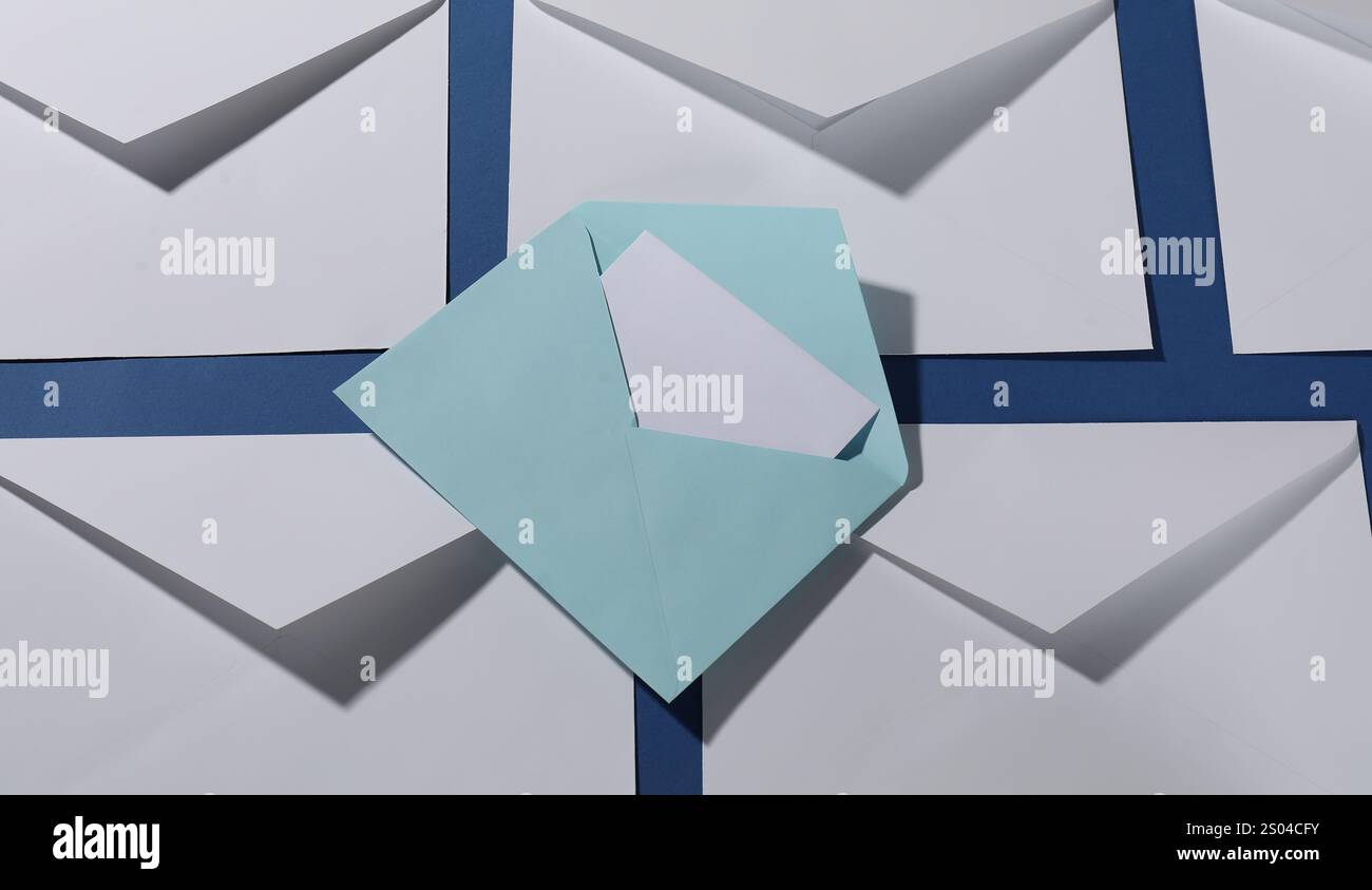 Paper envelopes with letter on blue background, above view. Mockup for ...
