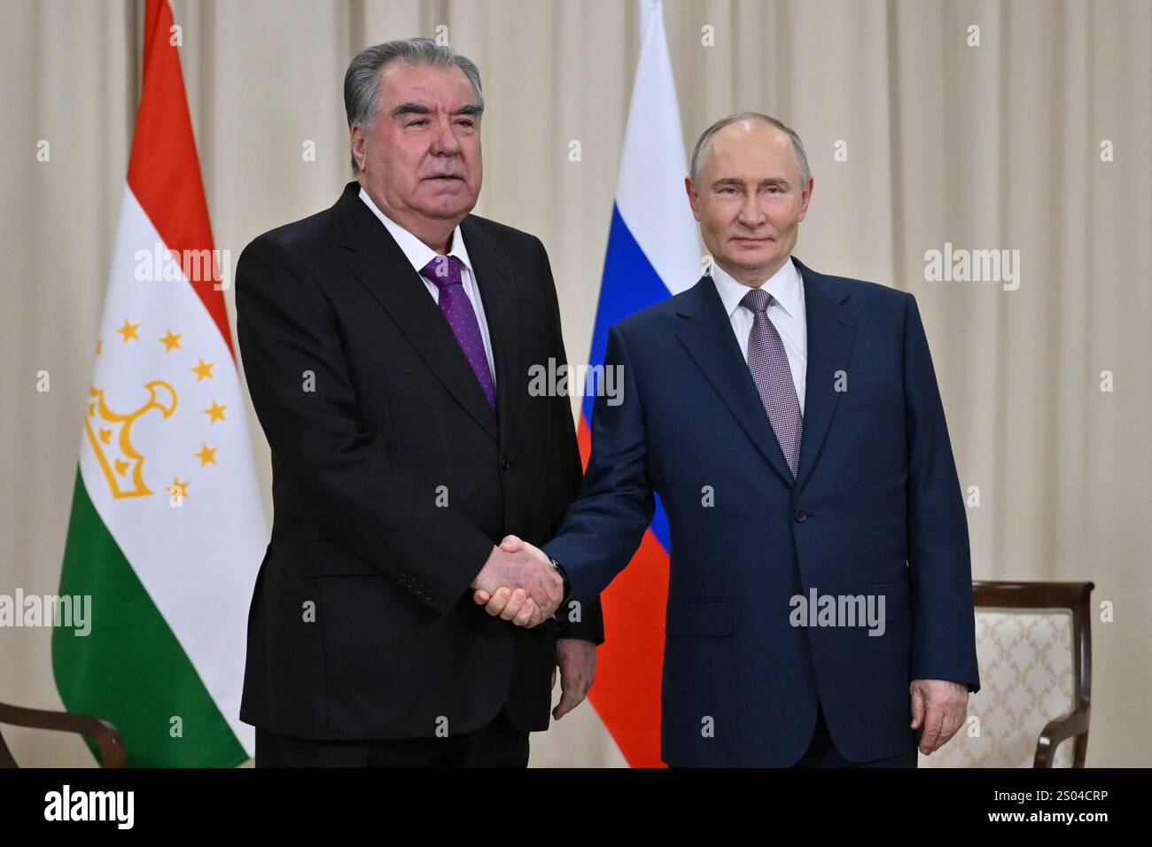 Russian President Vladimir Putin, right, and Tajik President Emomali ...