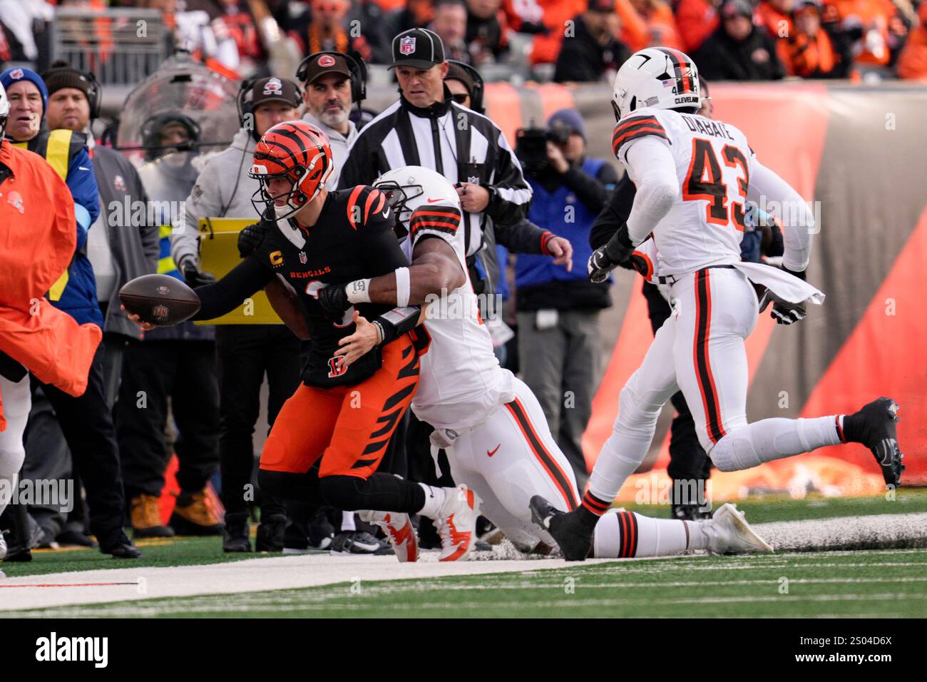 Cincinnati Bengals quarterback Joe Burrow (9) is tackled by Cleveland ...
