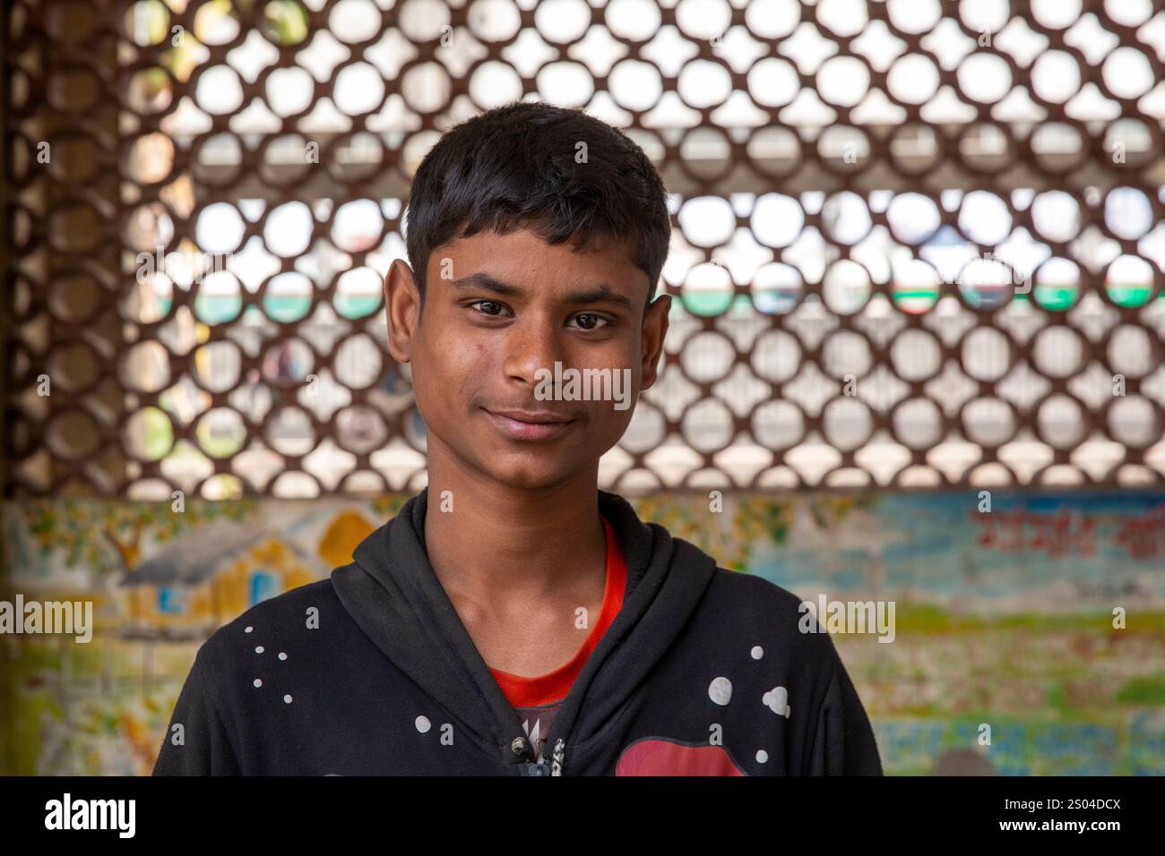 A poignant portrait of a street boy in Dhaka, Bangladesh, capturing the ...