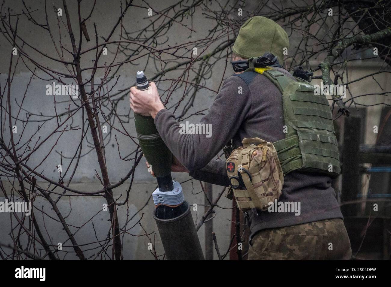 A Ukrainian serviceman of the 57th Mechanised Brigade fire 120mm mortar ...