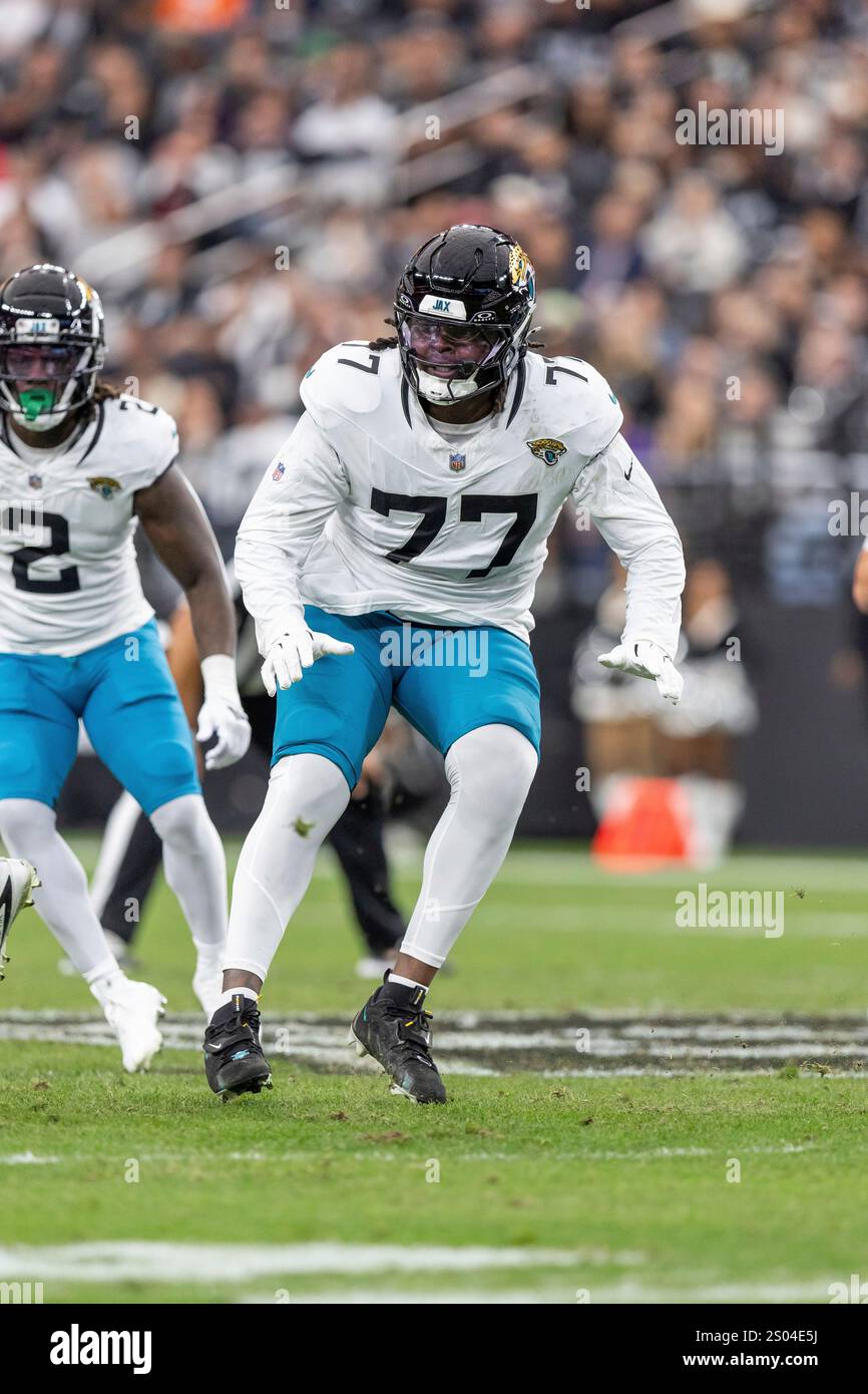 Jacksonville Jaguars tackle Anton Harrison (77) blocks against the Las ...