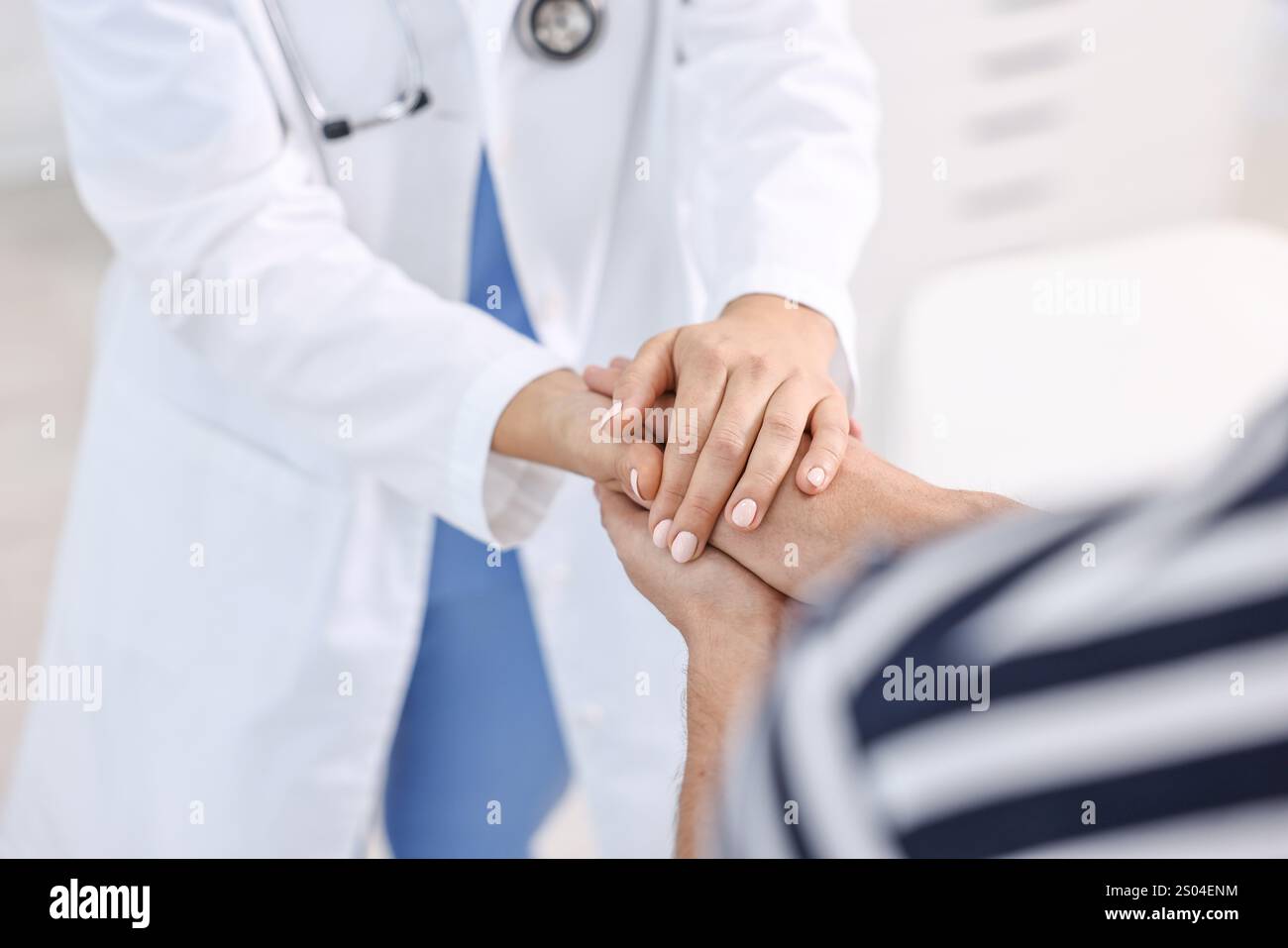 Healthcare worker supporting patient in hospital, closeup Stock Photo ...