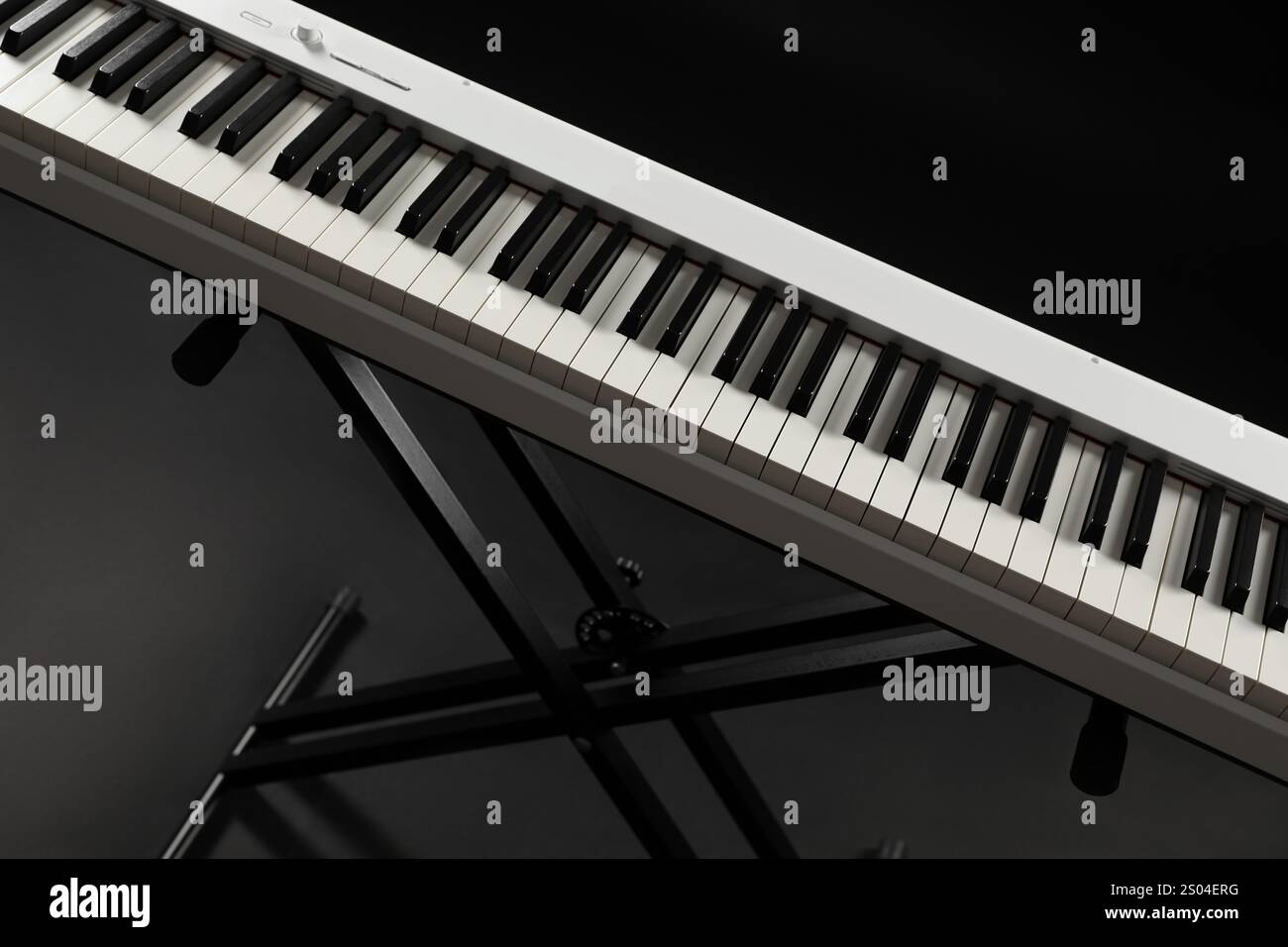 Synthesizer on black background, closeup. Electronic musical instrument ...
