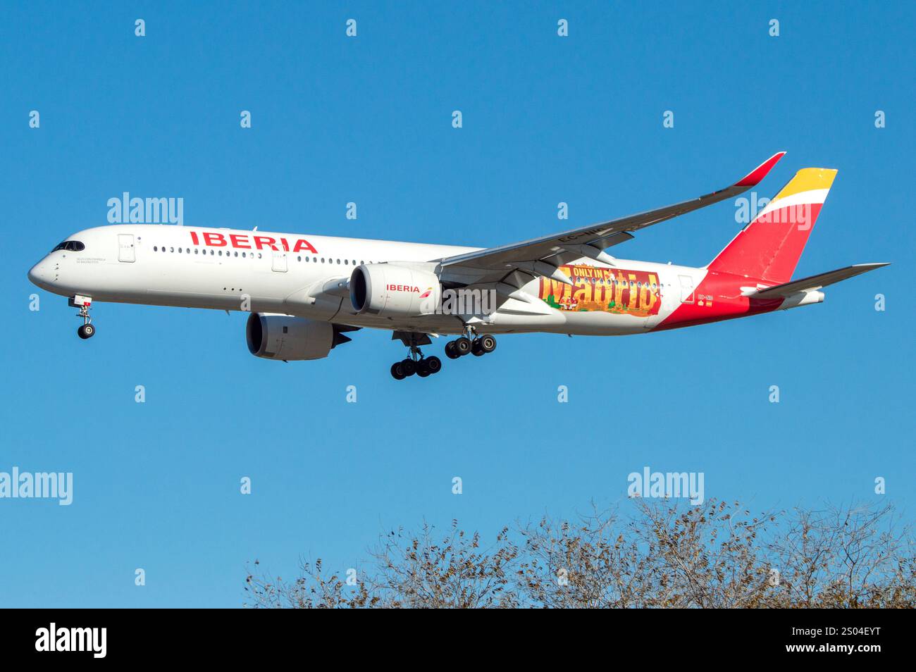 Modern long-haul airliner Airbus A350 of Iberia airline with special Madrid livery landing at ...
