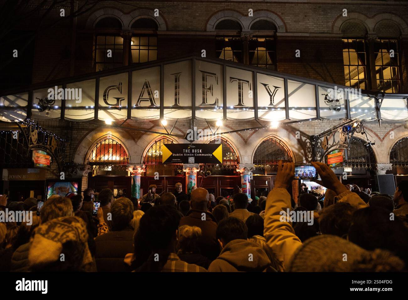 The annual Christmas Eve busk outside the Gaiety Theatre in Dublin, in ...