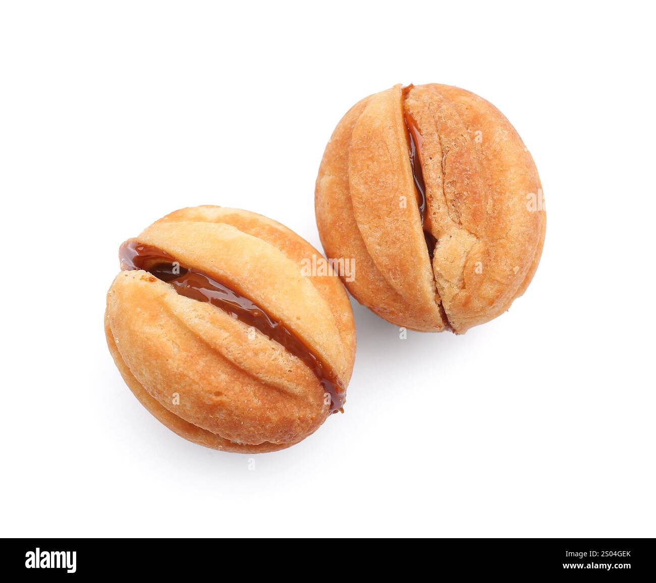 Sweet walnut shaped cookies with boiled condensed milk on white ...