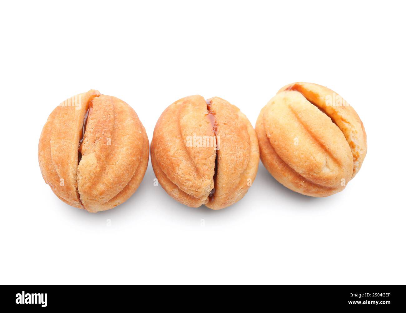 Sweet walnut shaped cookies with boiled condensed milk on white ...