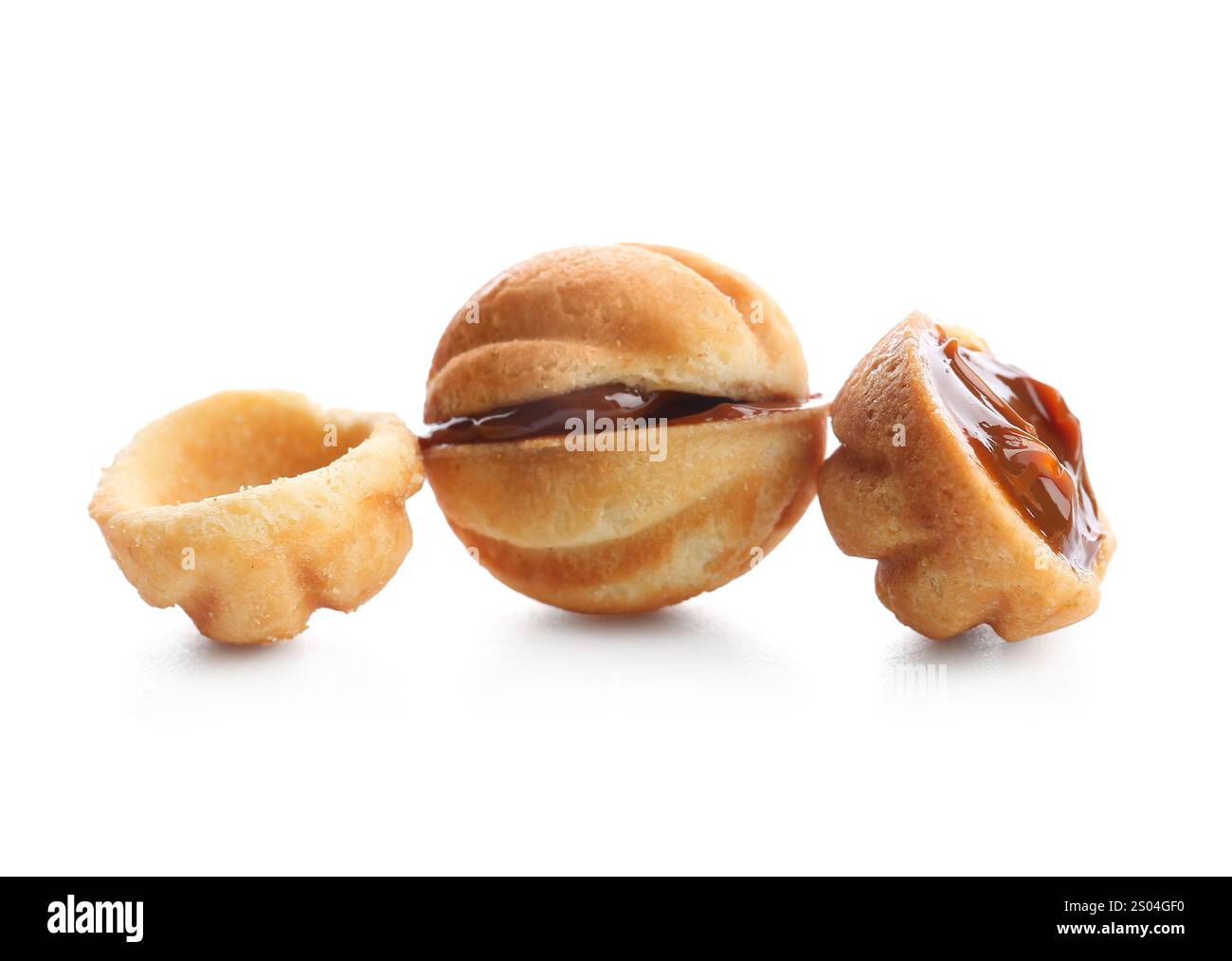 Sweet walnut shaped cookies with boiled condensed milk on white ...