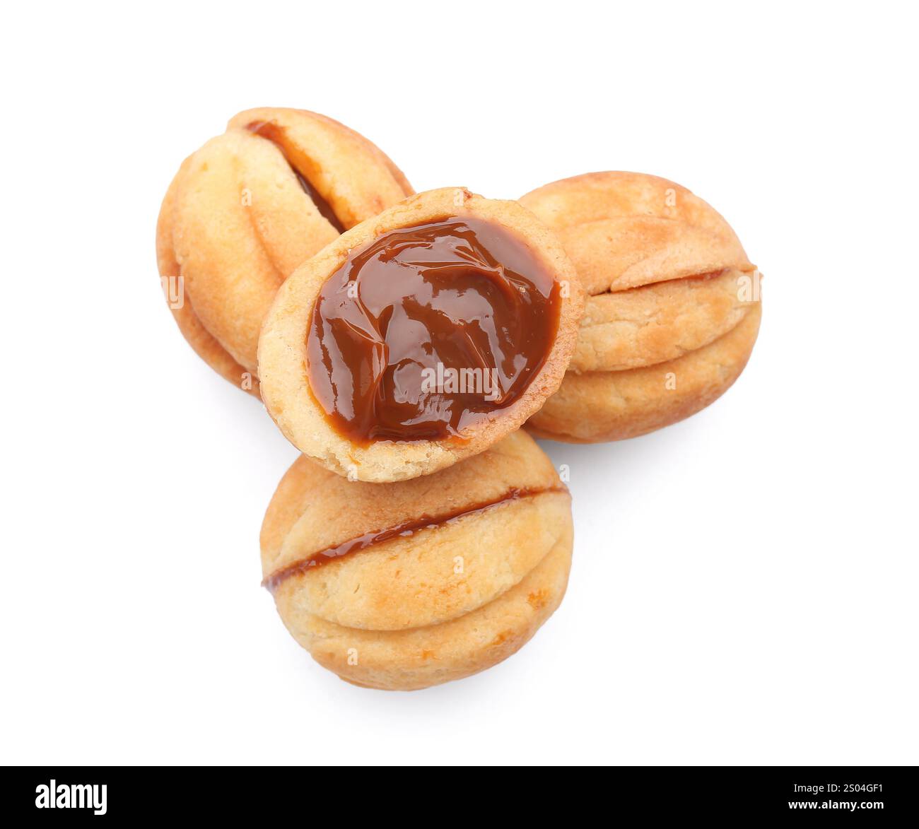 Many sweet walnut shaped cookies with boiled condensed milk on white ...