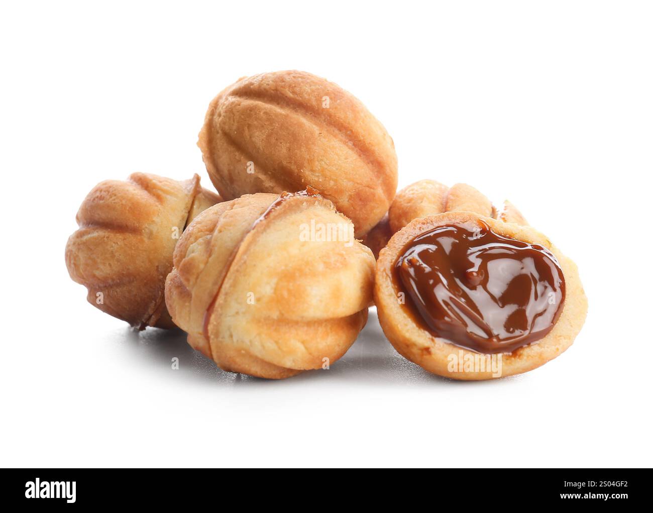 Many sweet walnut shaped cookies with boiled condensed milk on white ...