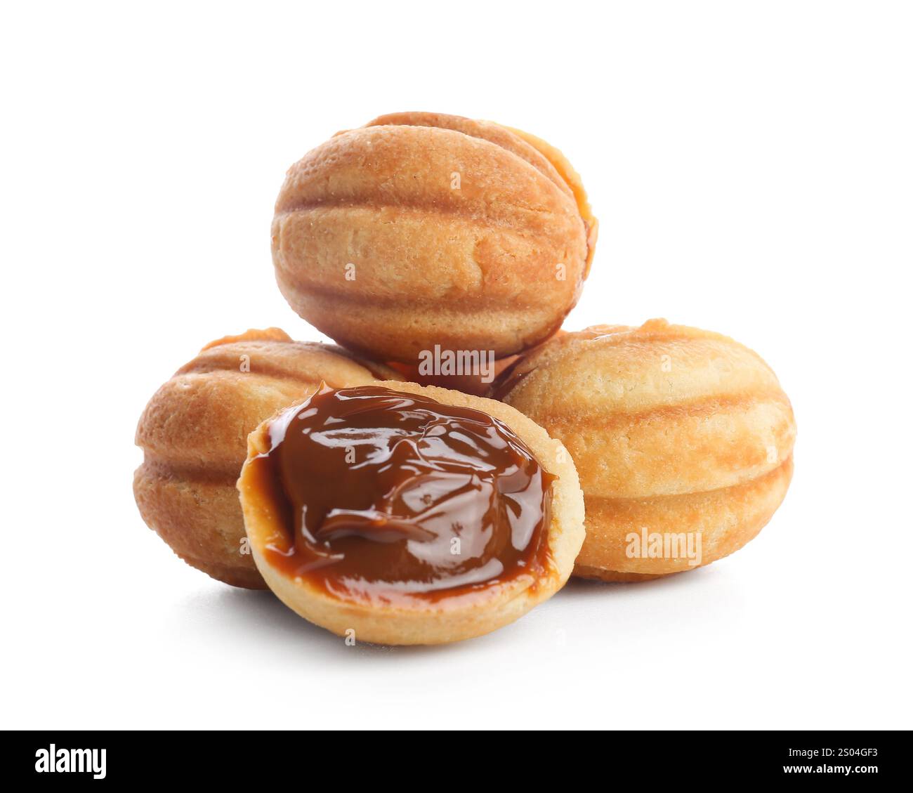 Sweet walnut shaped cookies with boiled condensed milk on white ...