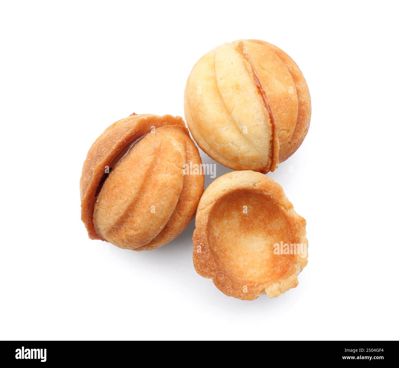 Sweet walnut shaped cookies with boiled condensed milk on white ...