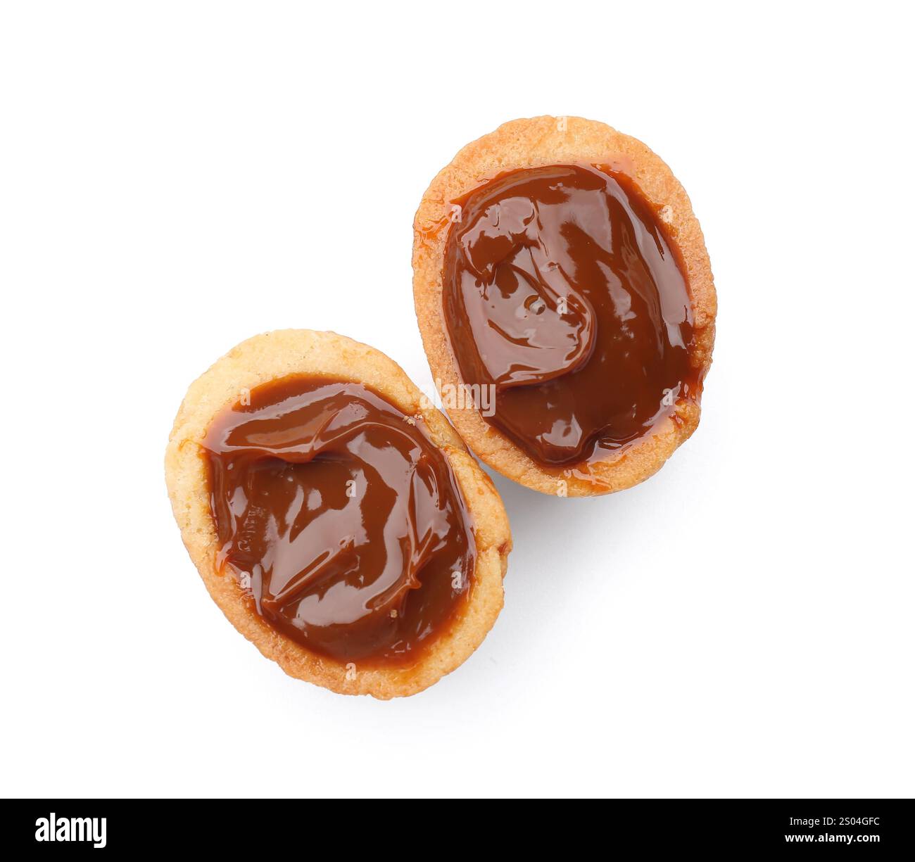 Halves of sweet walnut shaped cookie with boiled condensed milk on ...