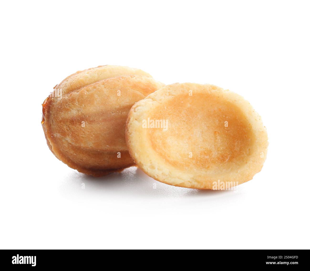 Sweet walnut shaped cookies with boiled condensed milk on white ...
