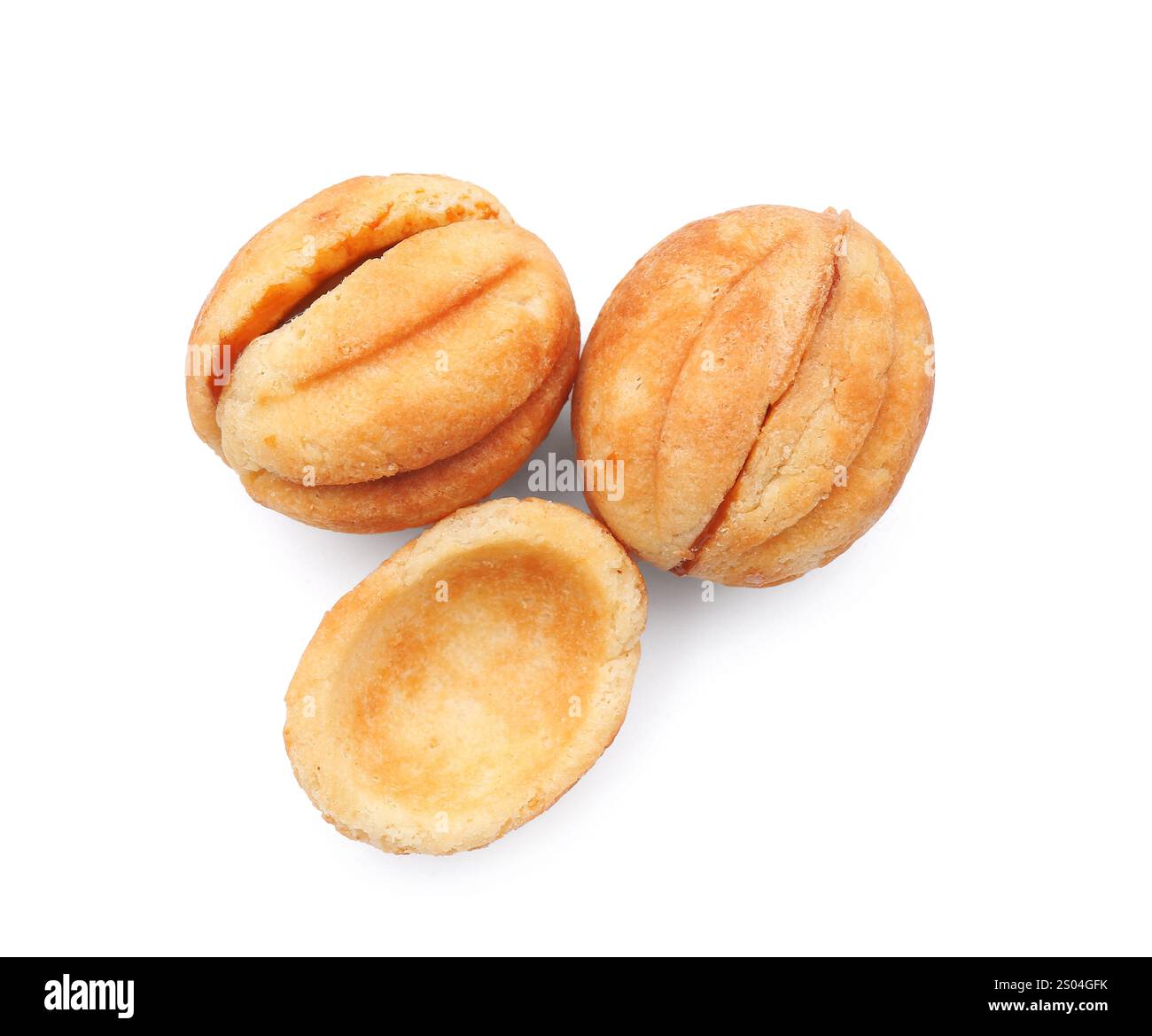 Sweet walnut shaped cookies with boiled condensed milk on white ...