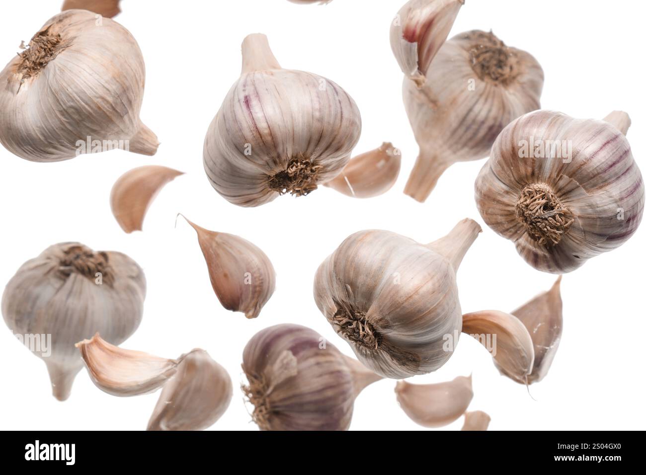 Flying fresh garlic and cloves on white background Stock Photo - Alamy