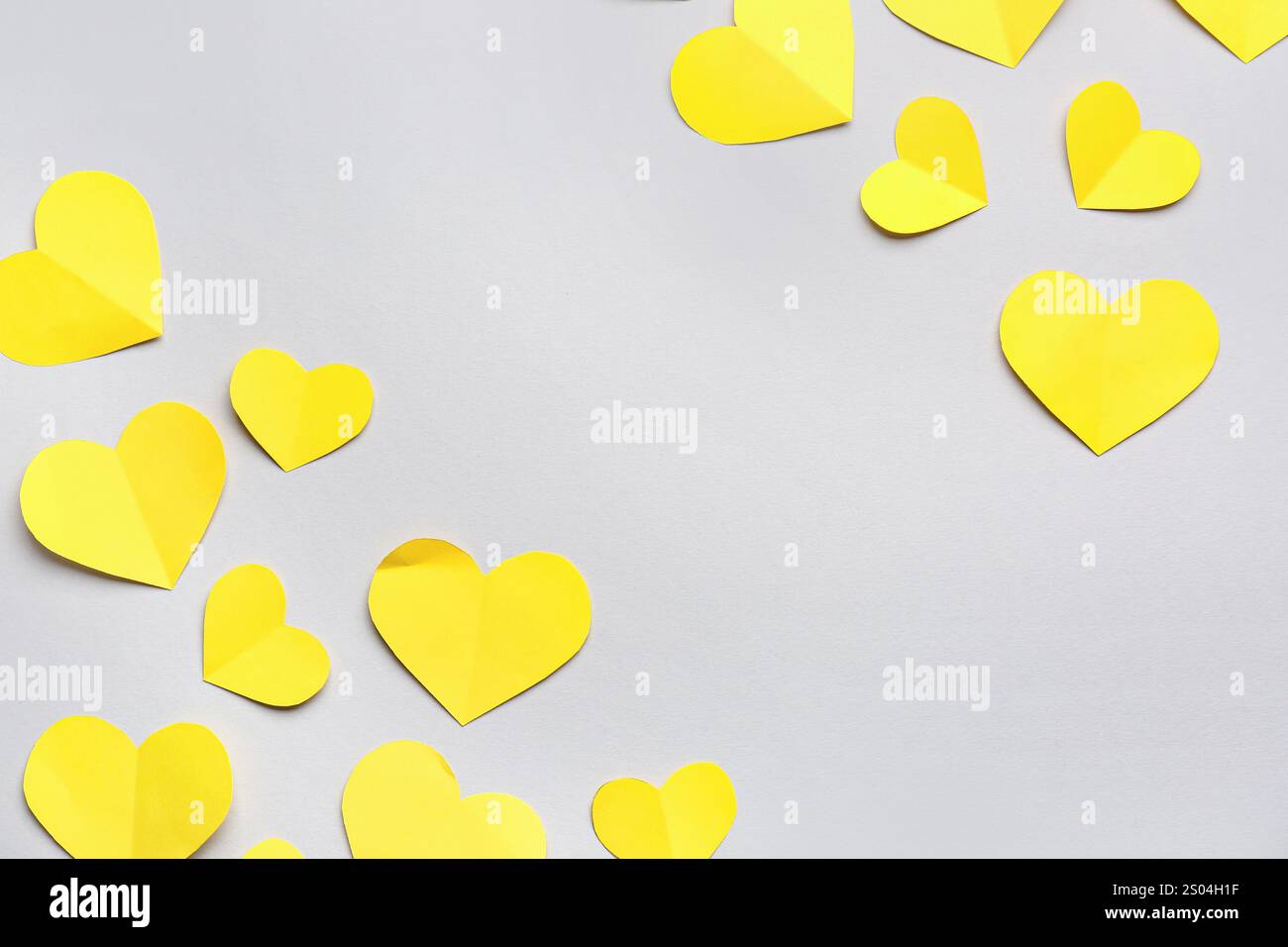 Yellow paper hearts on grey background. Valentine's Day celebration ...