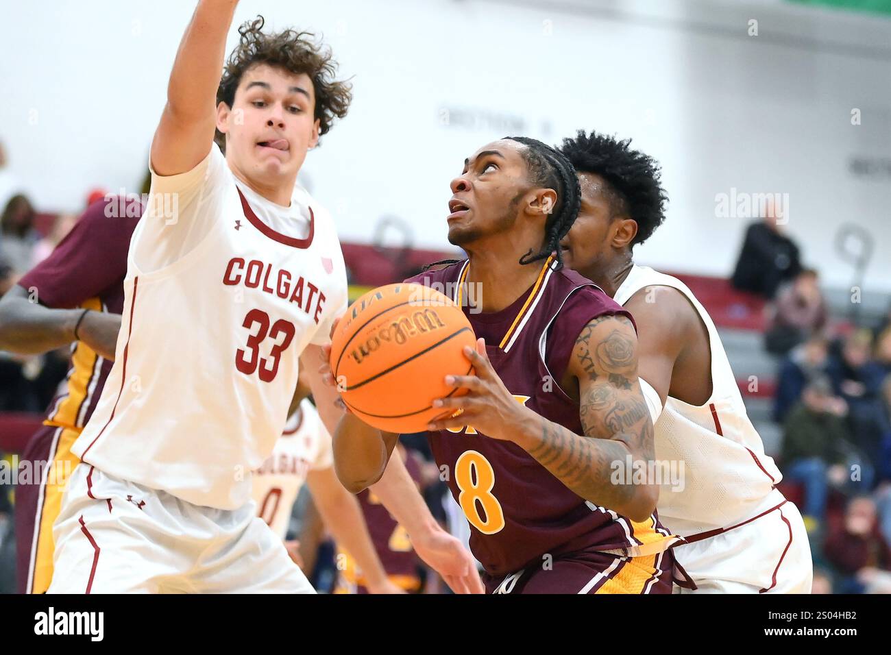 December 22, 2024: Iona Gaels guard Christian Winborne (8) drives ...