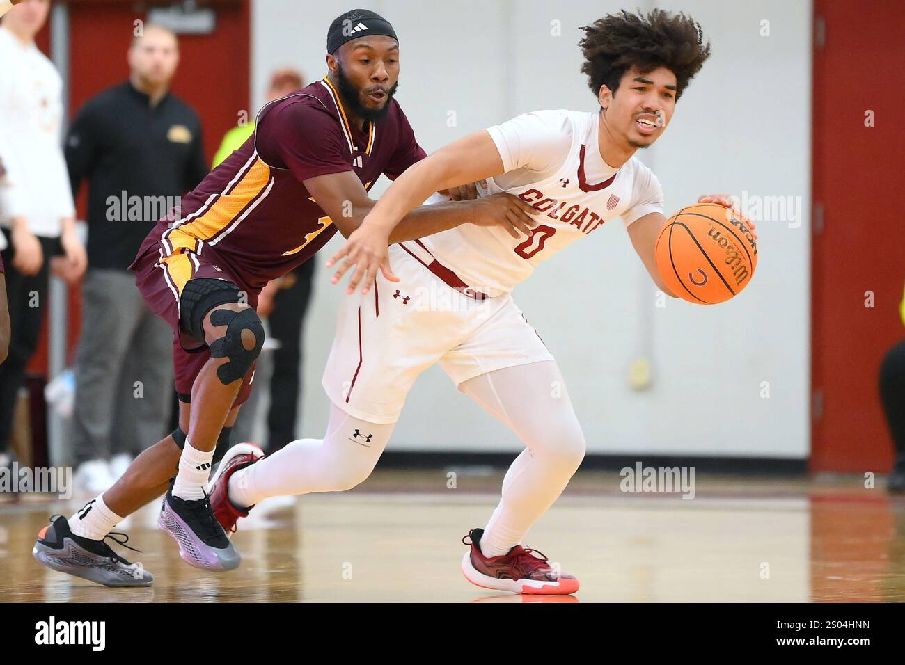 December 22, 2024: Colgate Raiders guard Julian Scott (0) controls the ...