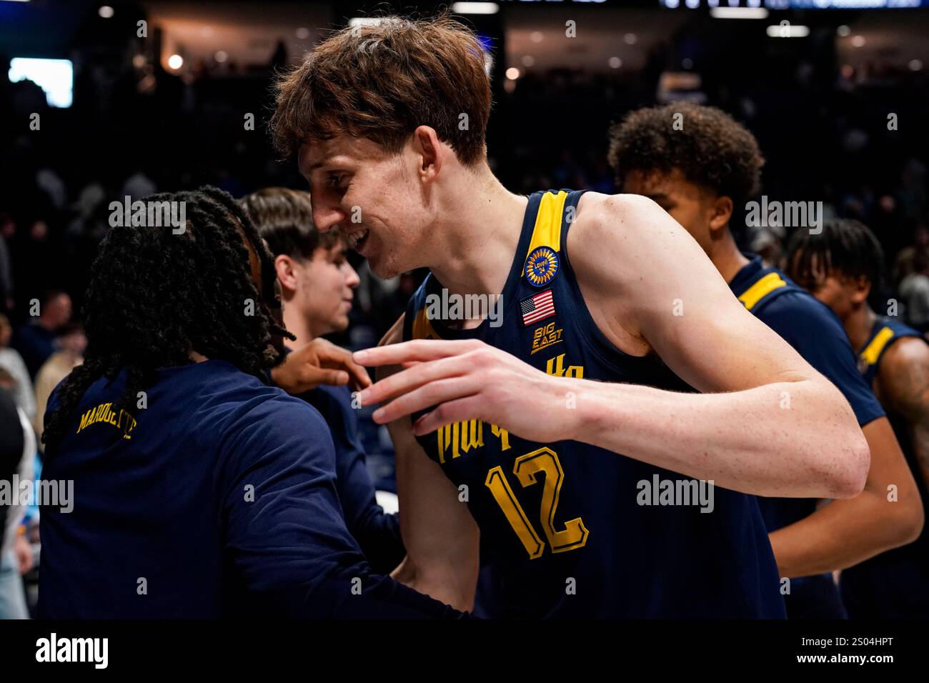 Marquette forward Ben Gold (12) celebrates with teammates following the ...