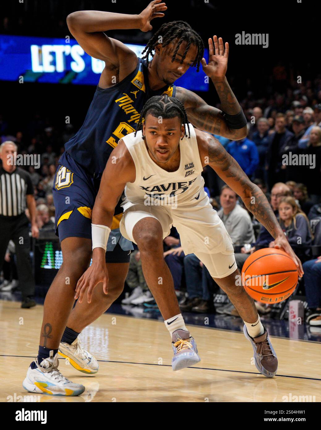 Xavier guard Dayvion McKnight (20) dribbles against Marquette guard Tre ...