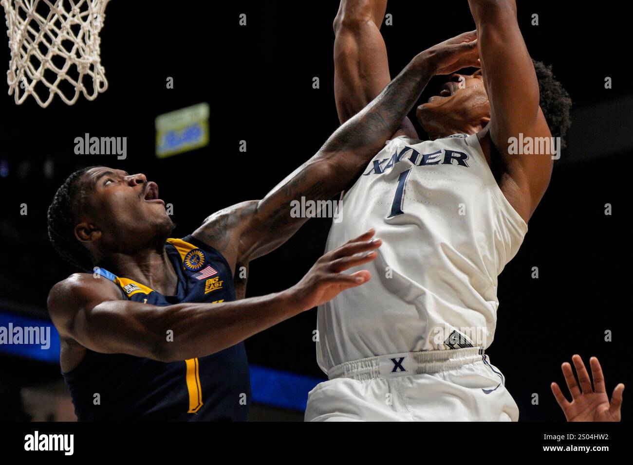 Xavier guard Marcus Foster (1) shoots against Marquette guard Kam Jones ...