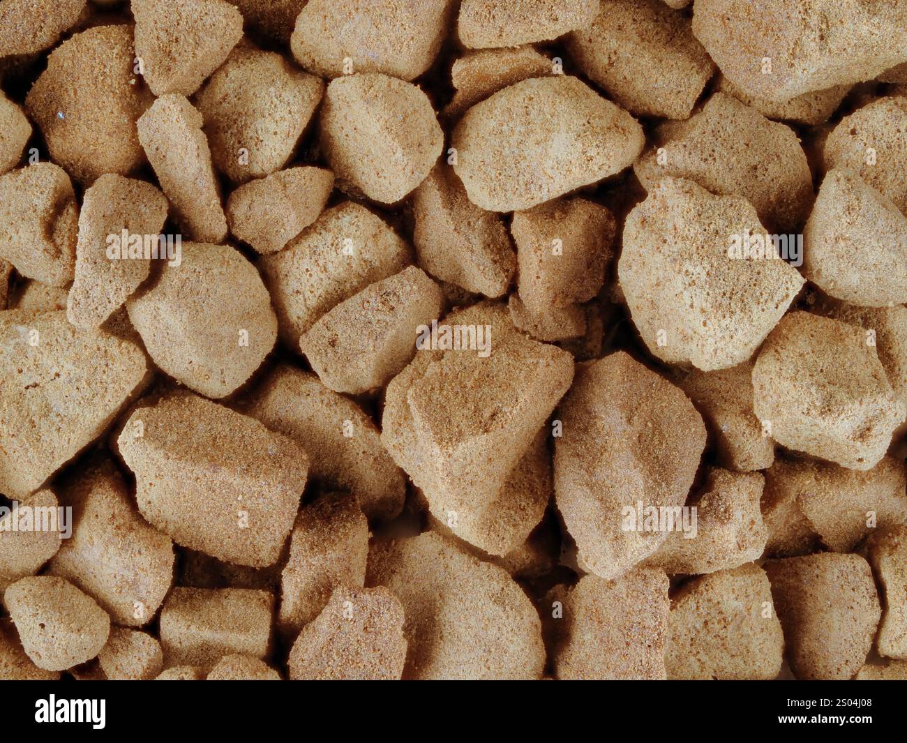 Rough texture of bumpy brown objects closeup. Close up of soluble ...