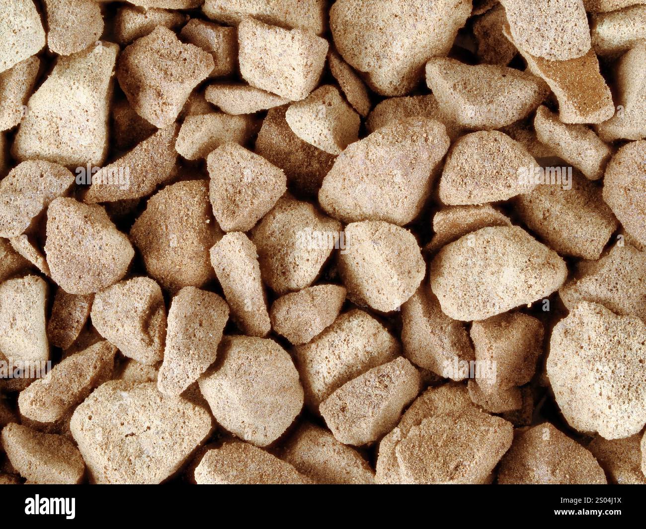 Rough texture of bumpy brown objects closeup. Close up of soluble ...