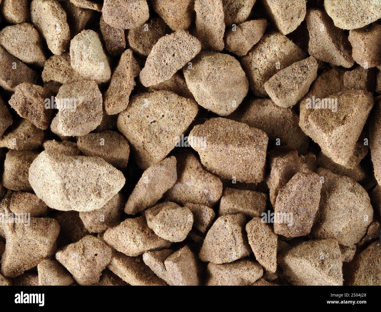Rough texture of bumpy brown objects closeup. Close up of soluble ...