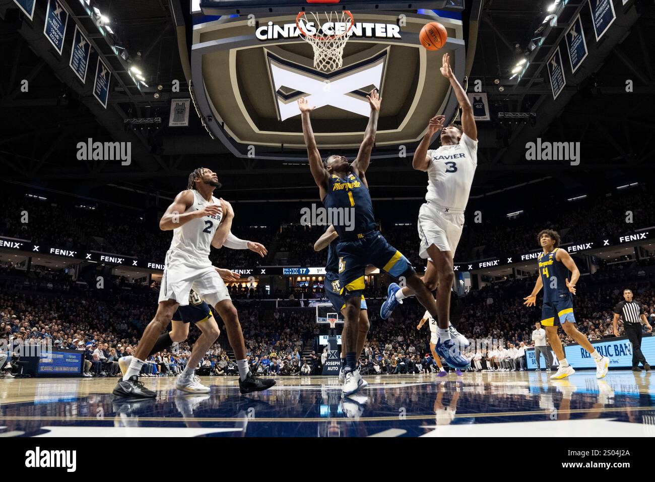 Xavier guard Dailyn Swain (3) shoots against Marquette guard Kam Jones ...