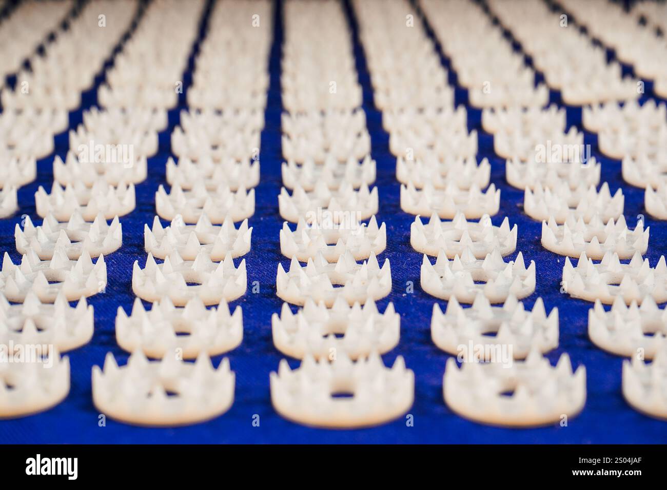 Close-up of a blue acupuncture mat designed for massage and relaxation ...