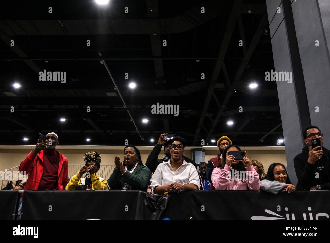 Richmond, Virginia, USA. 21st Dec, 2024. Attendees take in the action ...