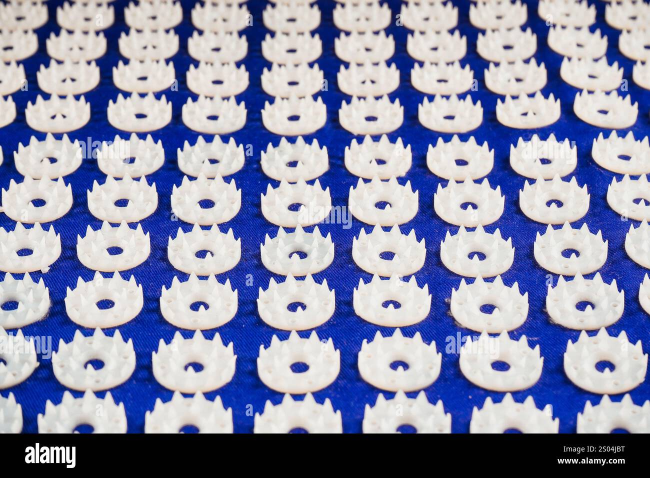 Close-up of a blue acupuncture mat designed for massage and relaxation ...