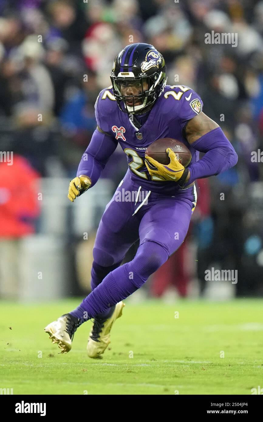 Baltimore Ravens running back Derrick Henry (22) rushes with the ball ...