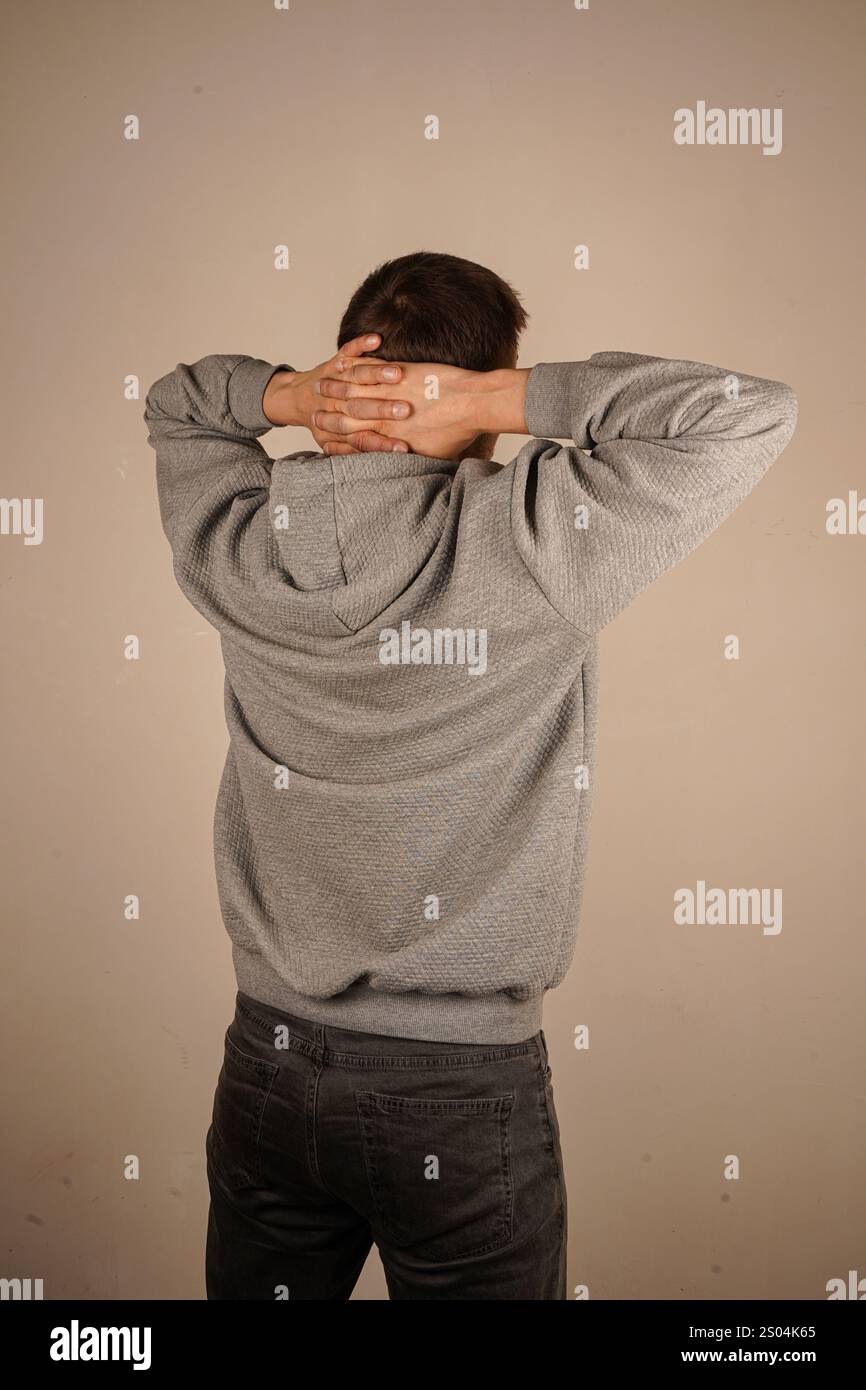 Relaxed and stretching arms and hands behind head and neck of middle ...