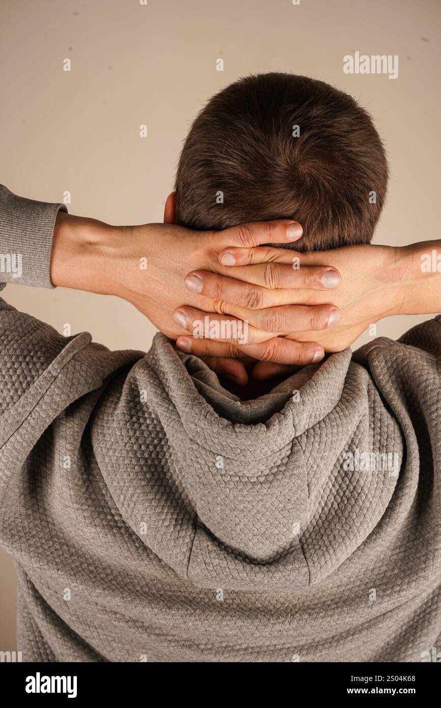 The isolated background emphasizes his casual, peaceful demeanor. A man ...