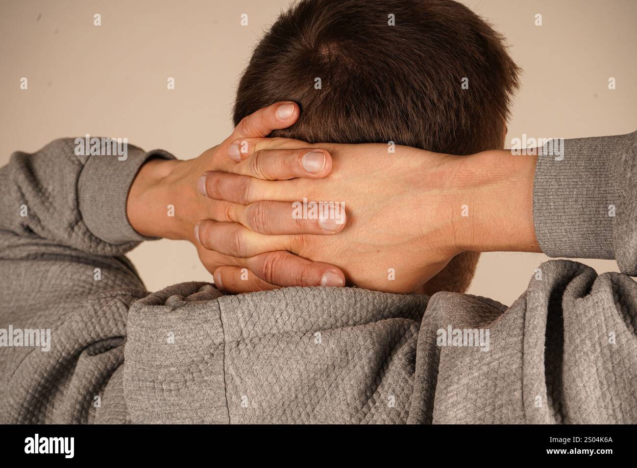 The isolated background emphasizes his casual, peaceful demeanor. A man ...