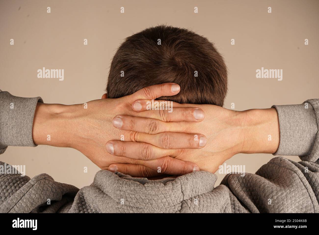 Hands on back of man's head. Relaxed and stretching arms and hands ...