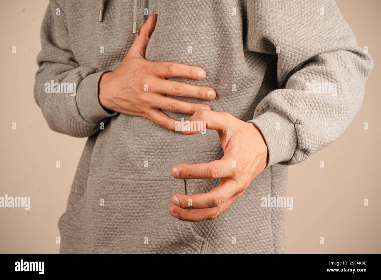 The neutral background enhances the focus on this universal gesture of ...