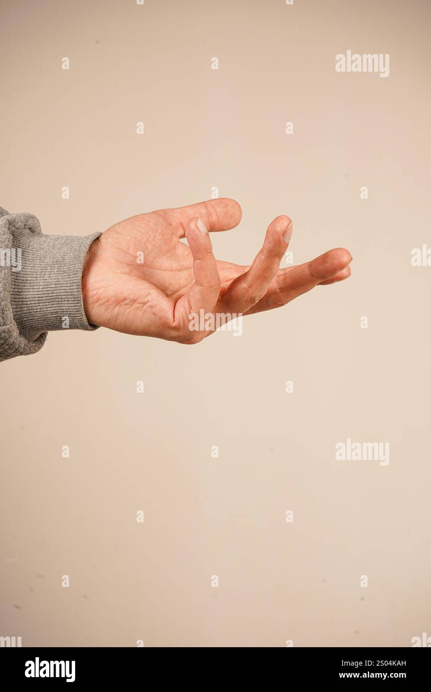 An open palm extended forward in a gesture of greeting or begging. The ...