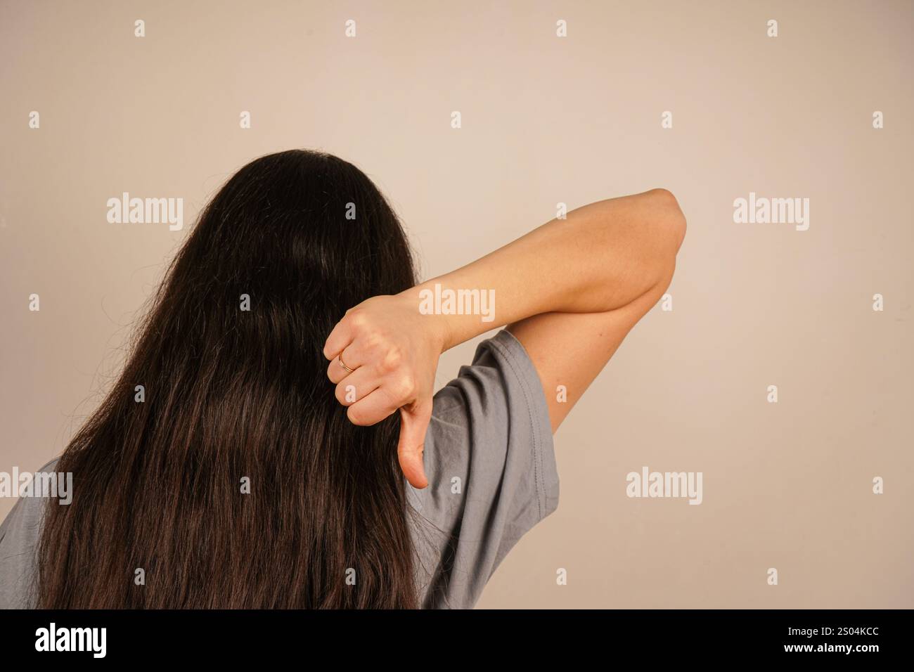 Close-up of a hand gesture of disapproval. Thumbs down gesture shows ...