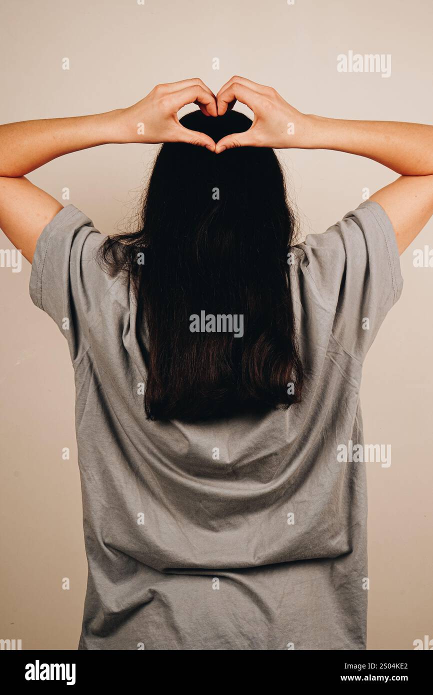 A heart formed by two hands. The gesture conveys love and unity. Its ...