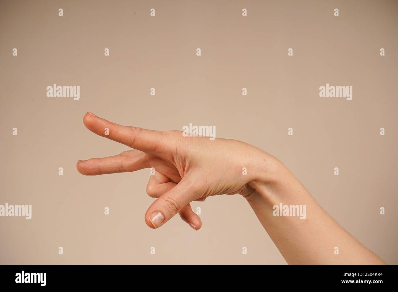 A close-up of a hand with the number three, with the index, middle, and ...